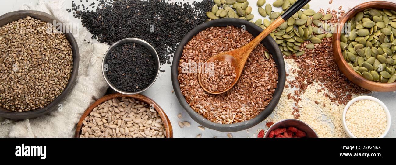 Variety of edible seeds on light background. Cereal and grains. Healthy ...