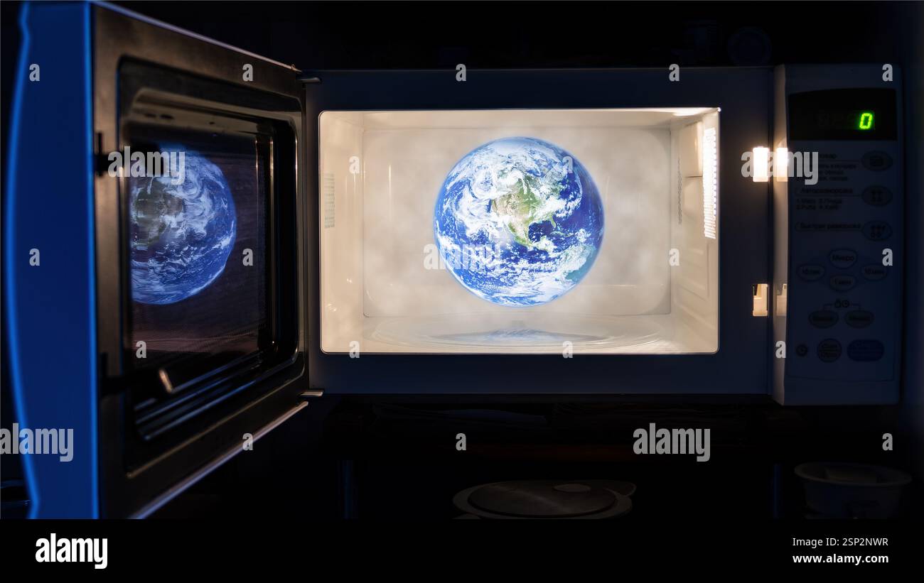 A striking conceptual photo of a microwave oven with the door open ...