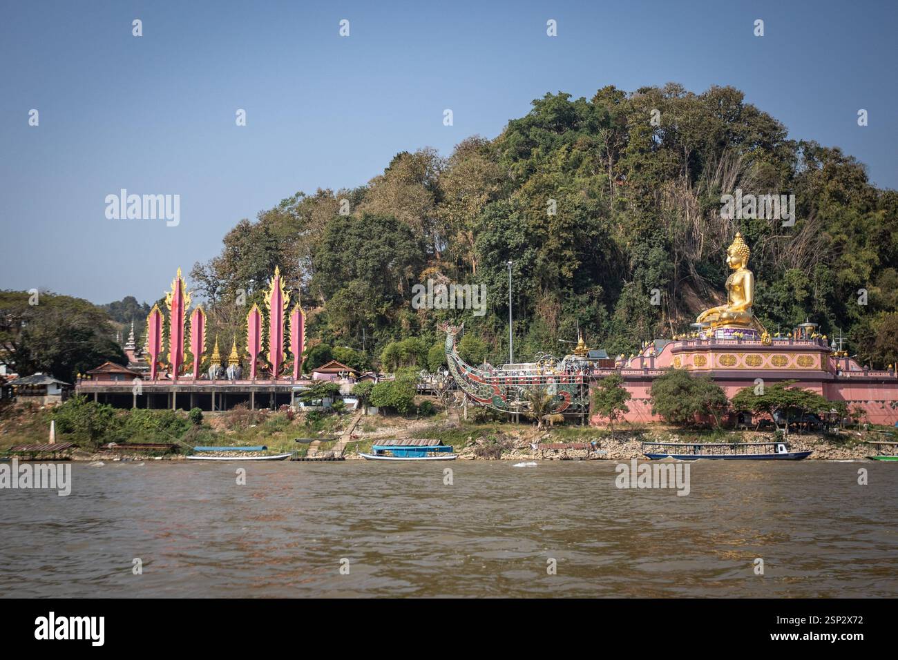 A view of the Golden Triangle Buddha statue from Thailand side. The ...