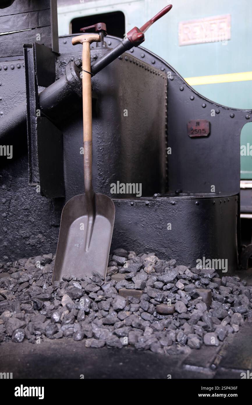 A shovel used to move coal from the engine tender to the firebox of the ...