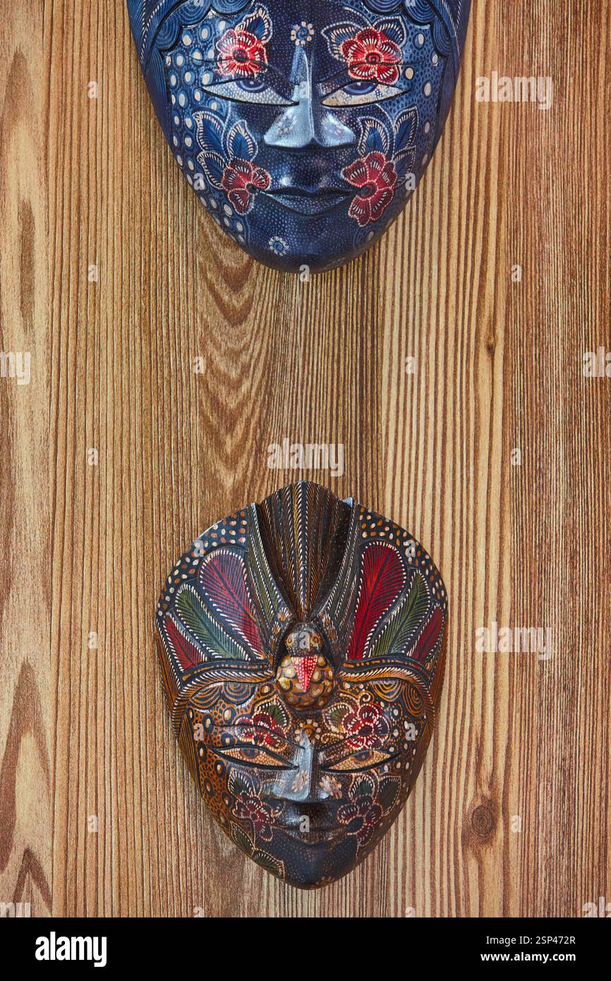 Traditional Indonesian handcrafted masks with wooden background. Asian ...