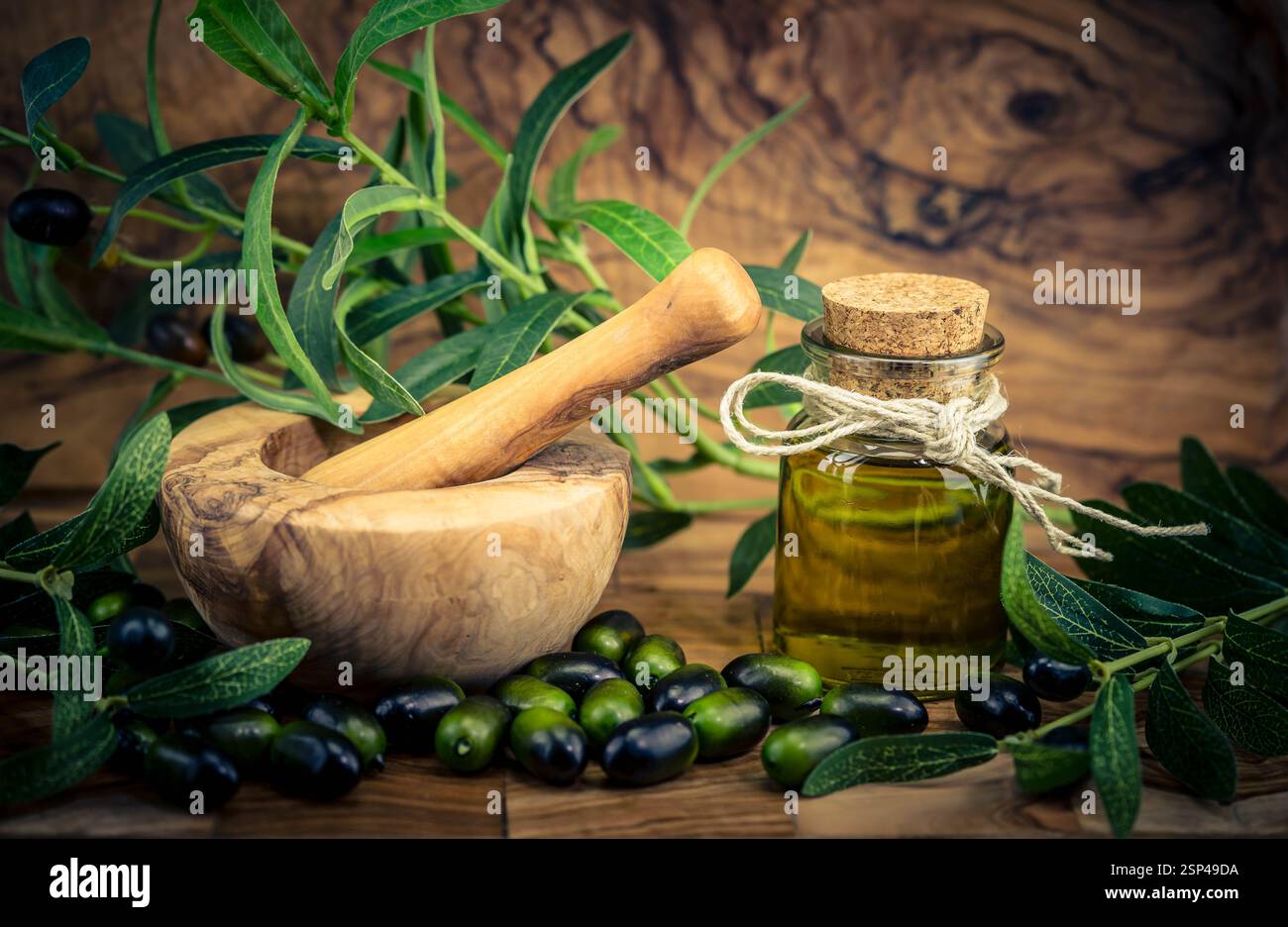 cold pressed extra virgin olive oil on olive wood Stock Photo - Alamy
