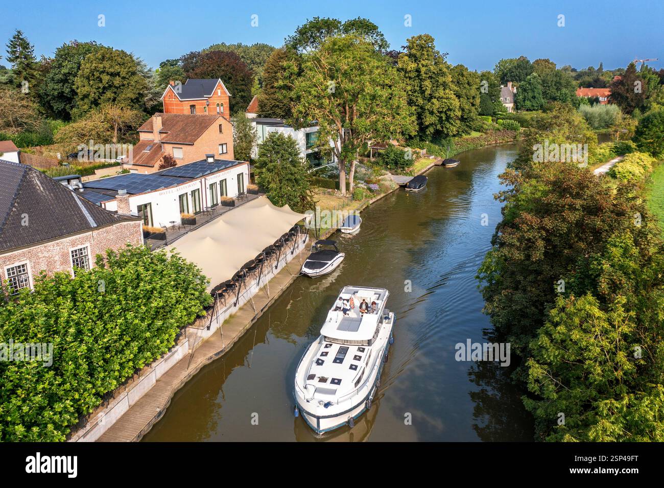Rental boat in the Lys river between Deinze and Gent, Flanders, Belgium ...