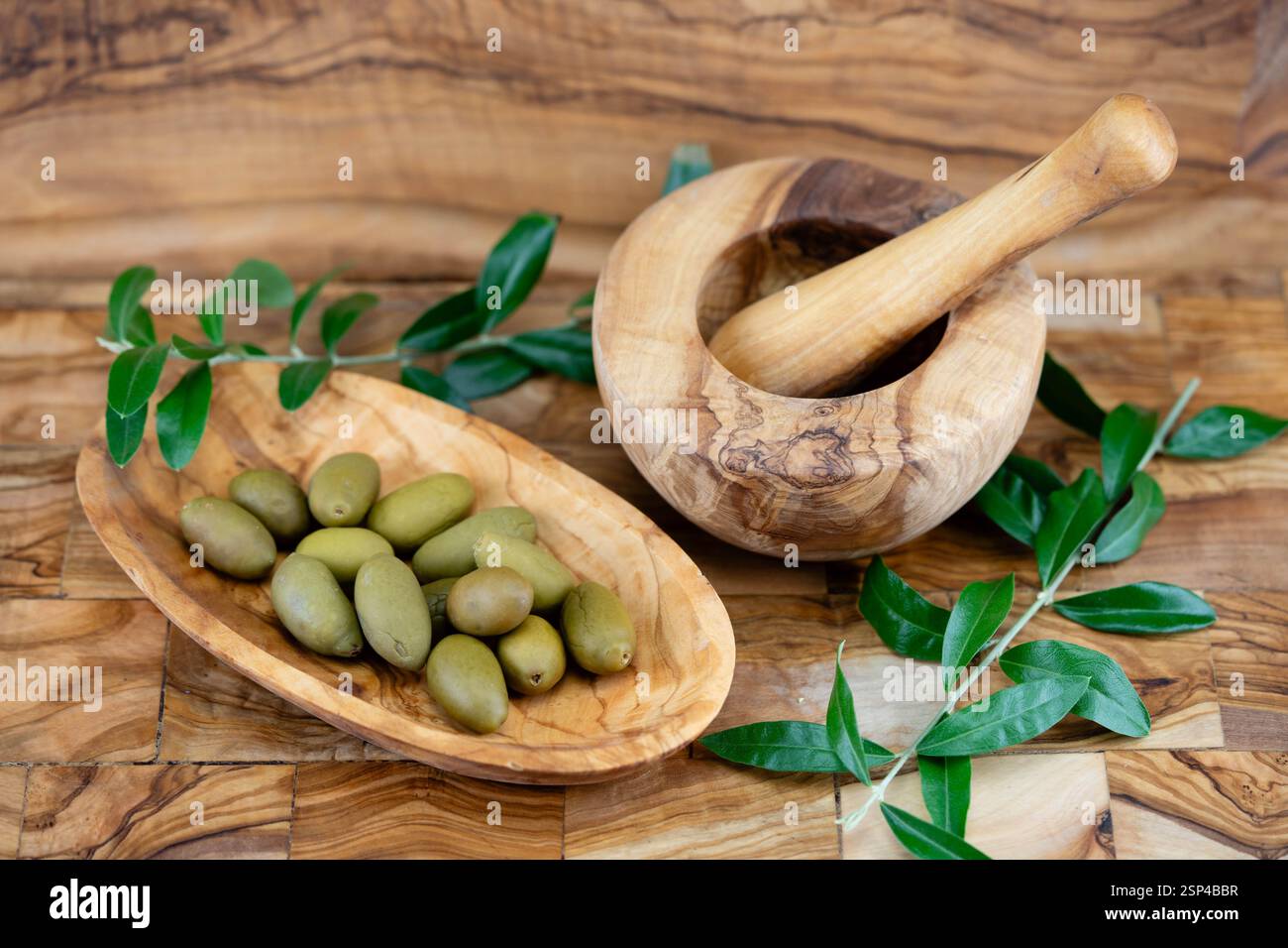 cold pressed extra virgin olive oil on olive wood Stock Photo - Alamy