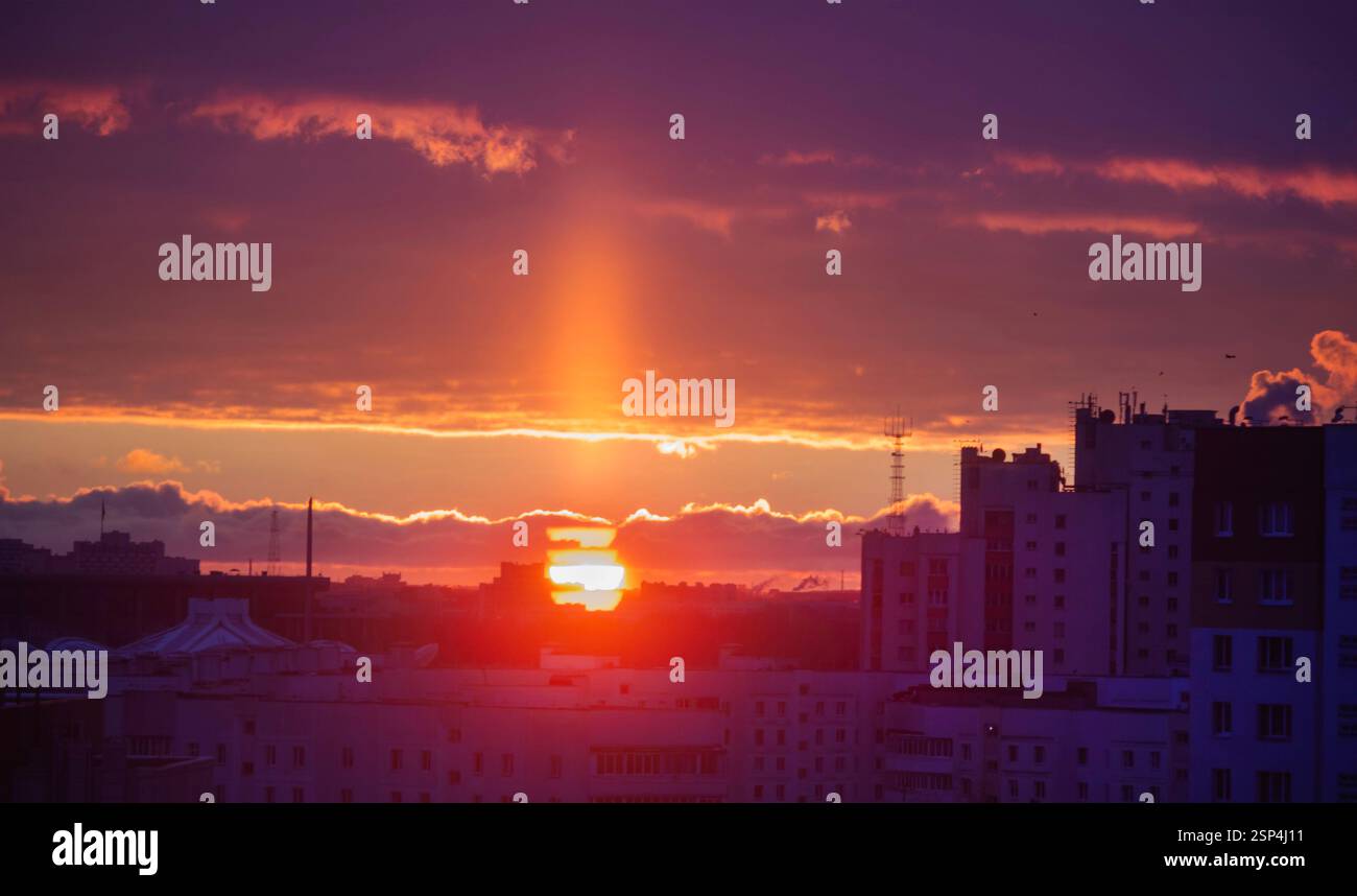 The sun rises above the horizon over houses in Europe Stock Photo - Alamy