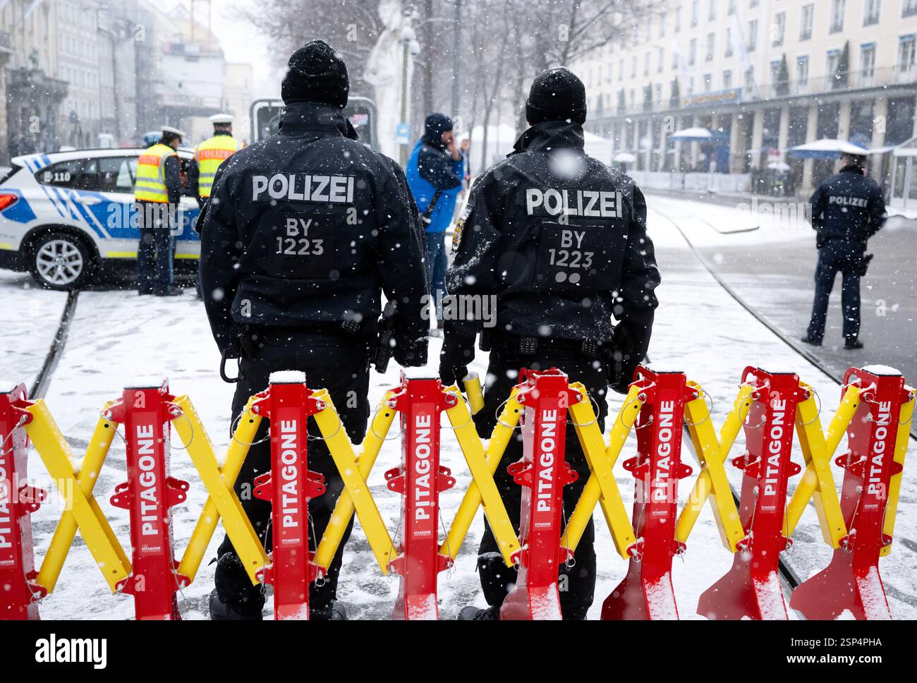 Munich, Germany. 14th Feb, 2025. Police officers stand in front of the ...