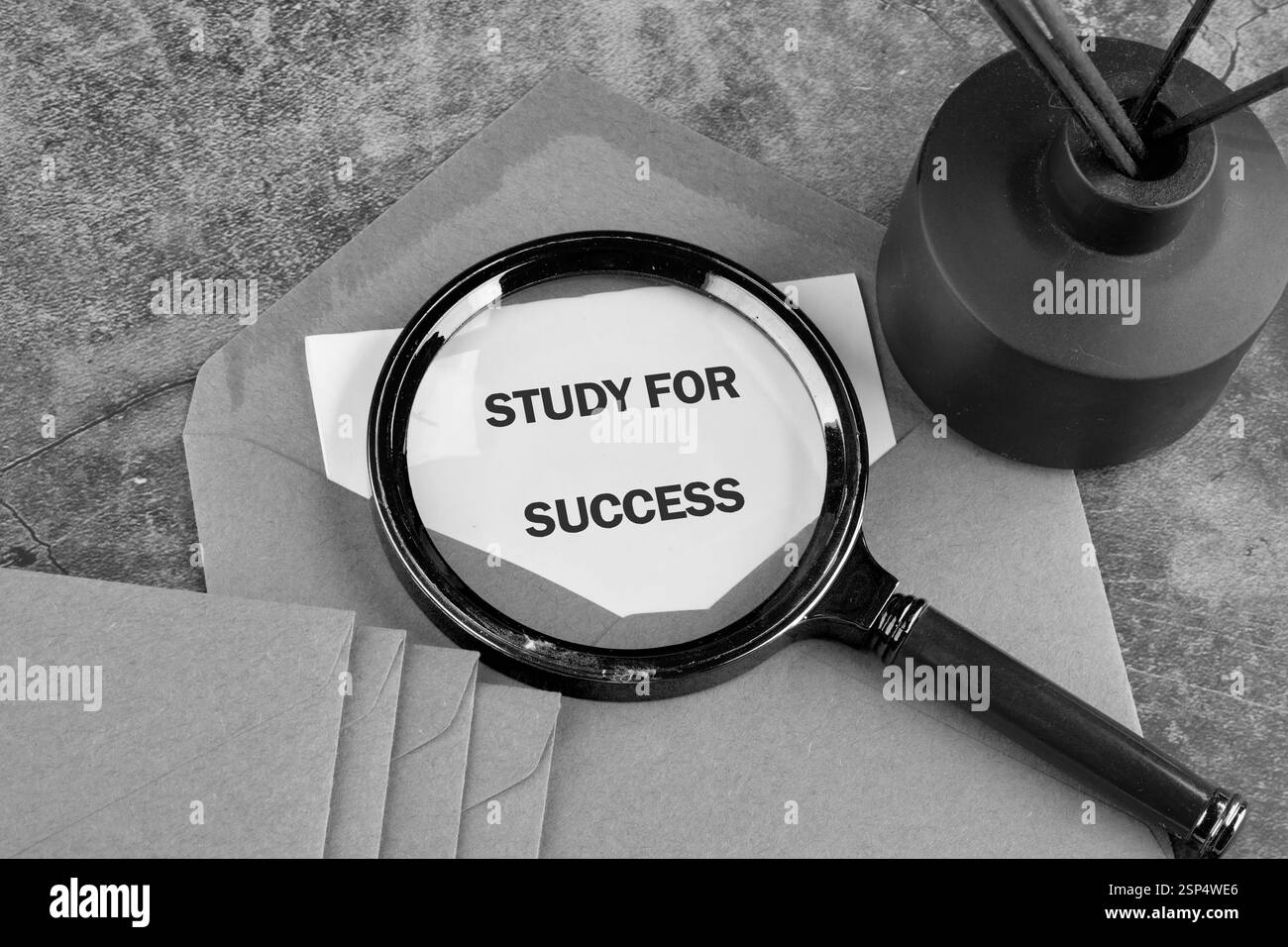 Study concepts for achieving success are highlighted with a magnifying glass over the text ...