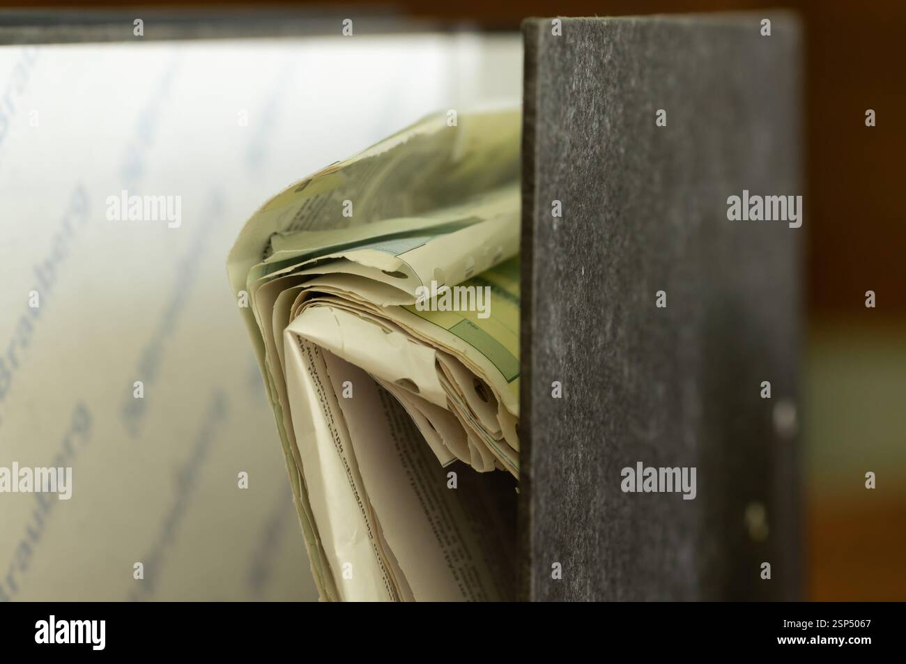 Old dusty stack of papers, files, documents on the shelves of archive ...