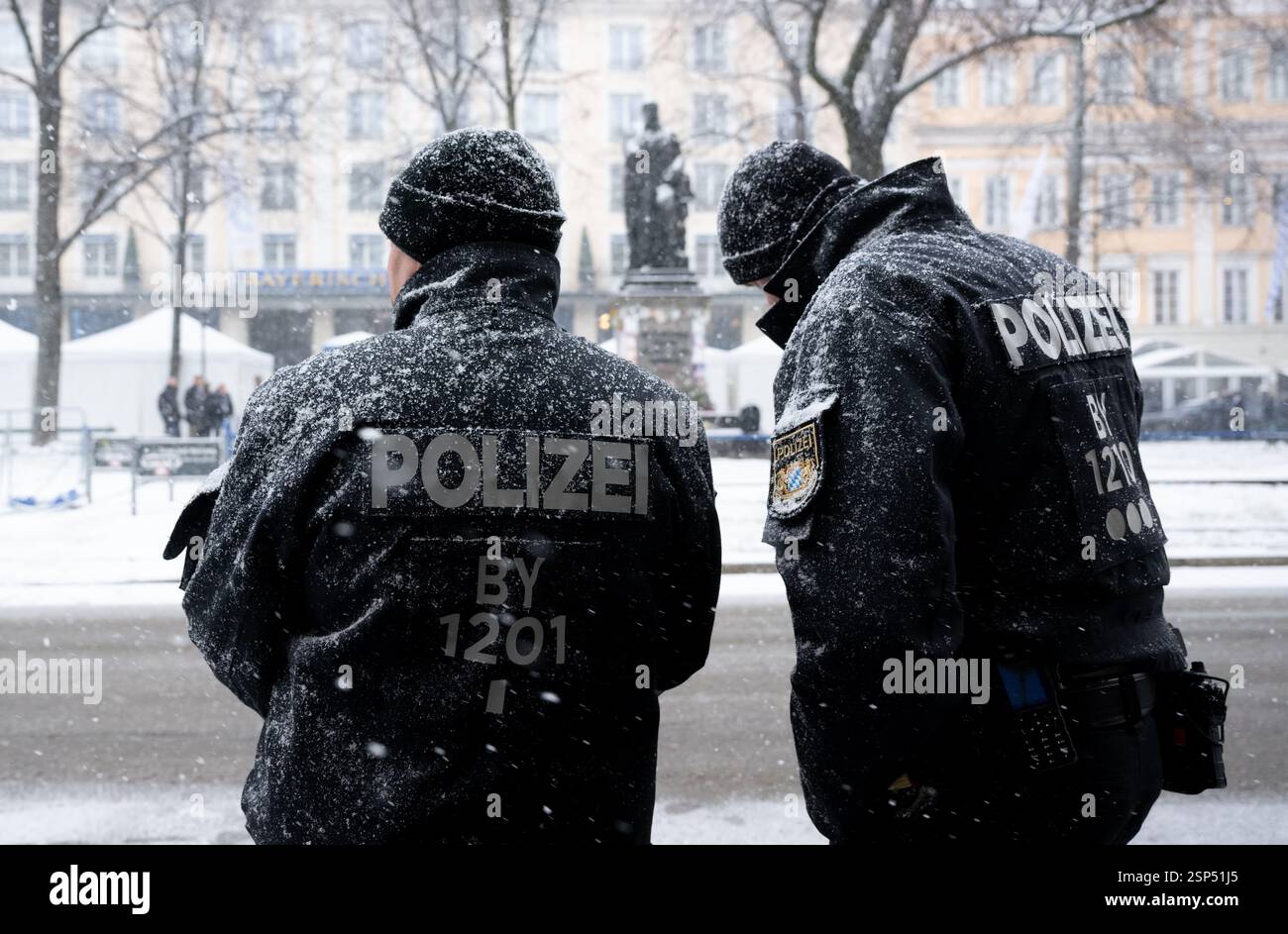 Munich, Germany. 14th Feb, 2025. Police officers stand in front of the ...