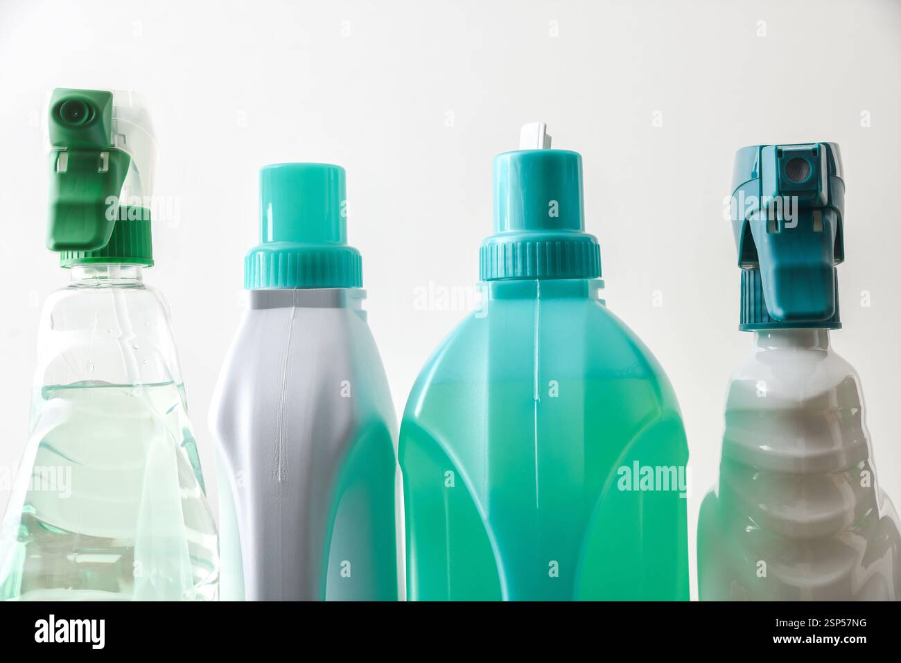 Detail of the top of four plastic containers of different types with ...