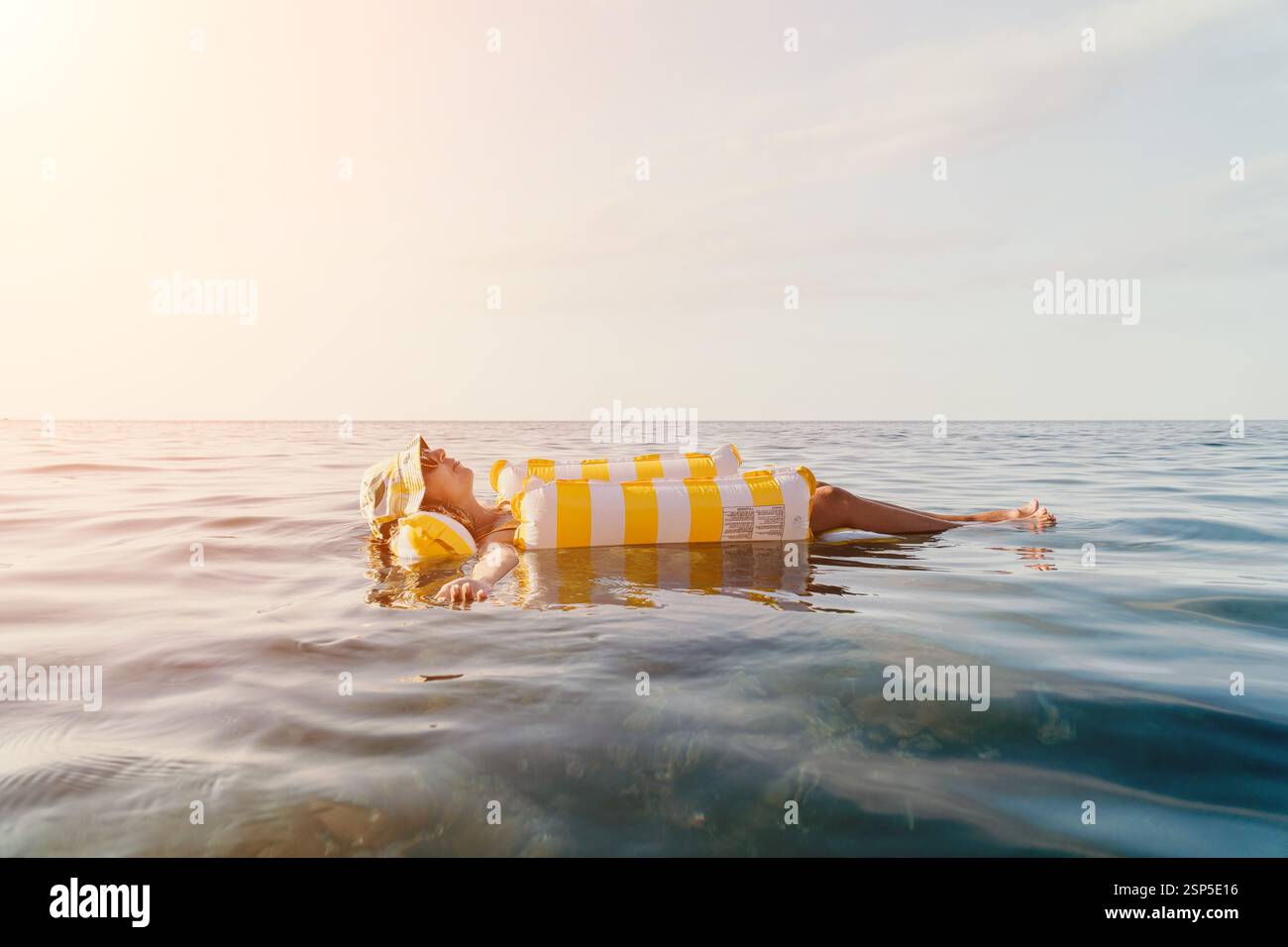 Woman Inflatable Float Relaxing Ocean - A woman relaxes on an ...