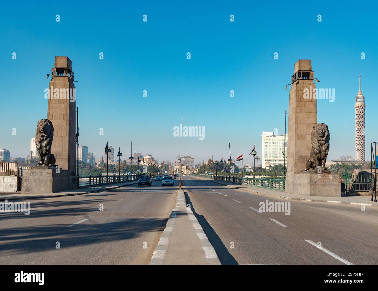 The historic Qasr El-Nile Bridge in Cairo, Egypt, featuring its iconic lion statues and Cairo ...