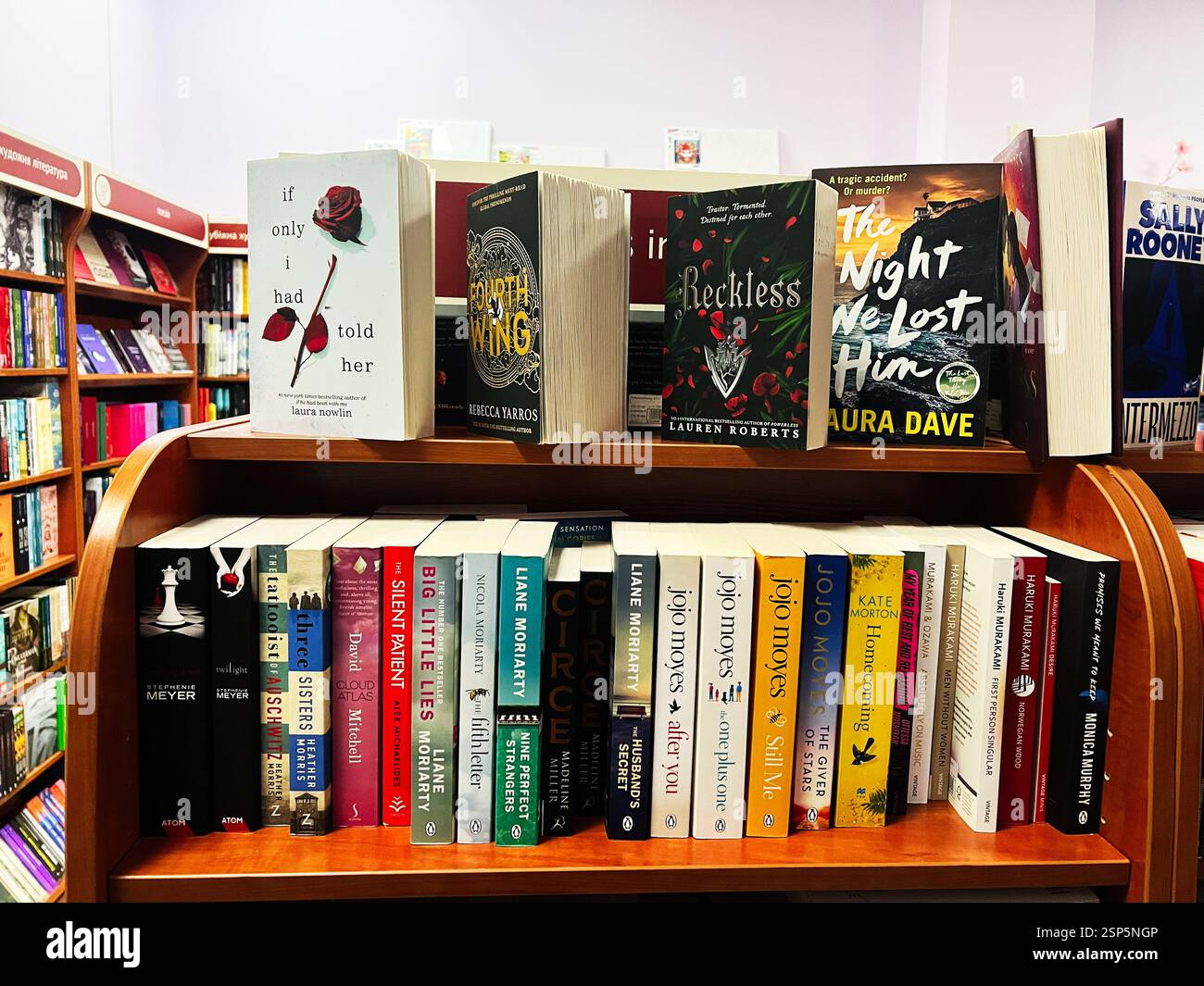 Lviv, Ukraine - February 13, 2025: Bookshelf showcasing various novels ...