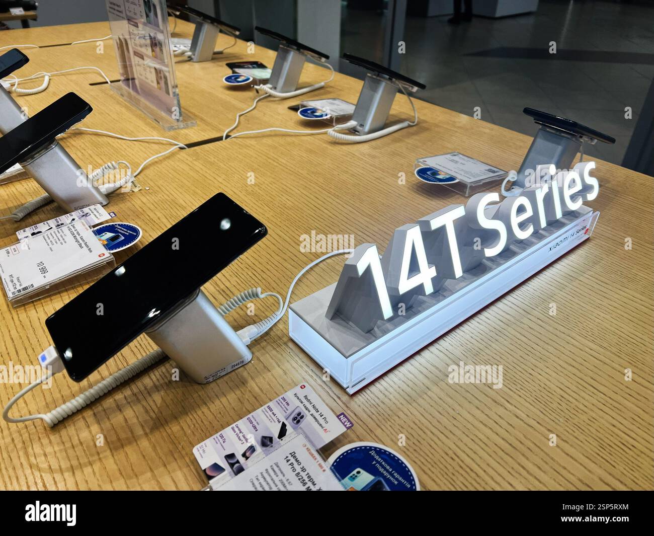 Lviv, Ukraine - February 13, 2025: A Xiaomi retail store display showcasing modern smartphones ...