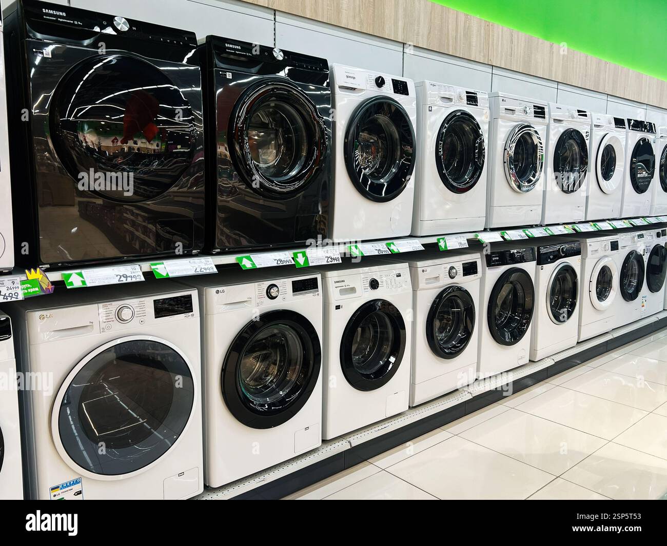 Lviv, Ukraine - February 13, 2025: A lineup of front-loading washing ...