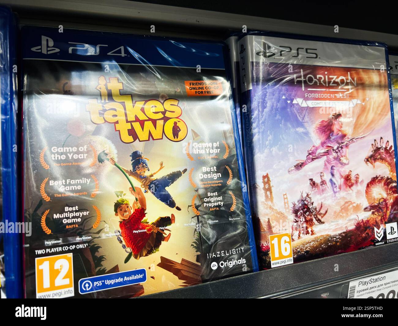 Lviv, Ukraine - February 13, 2025: Display of PS4 and PS5 games ...