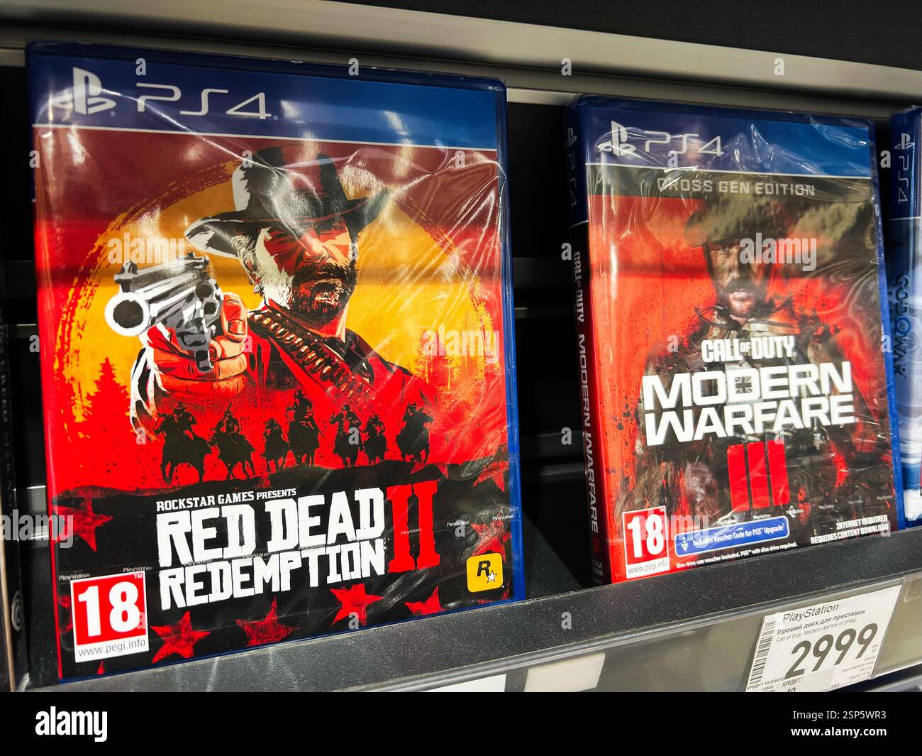 Lviv, Ukraine - February 13, 2025: Retail display of Red Dead Redemption II and Modern Warfare ...