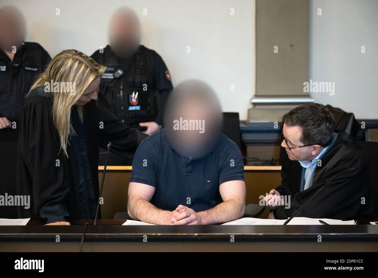 14 February 2025, Lower Saxony, Verden: The defendant sits next to his ...