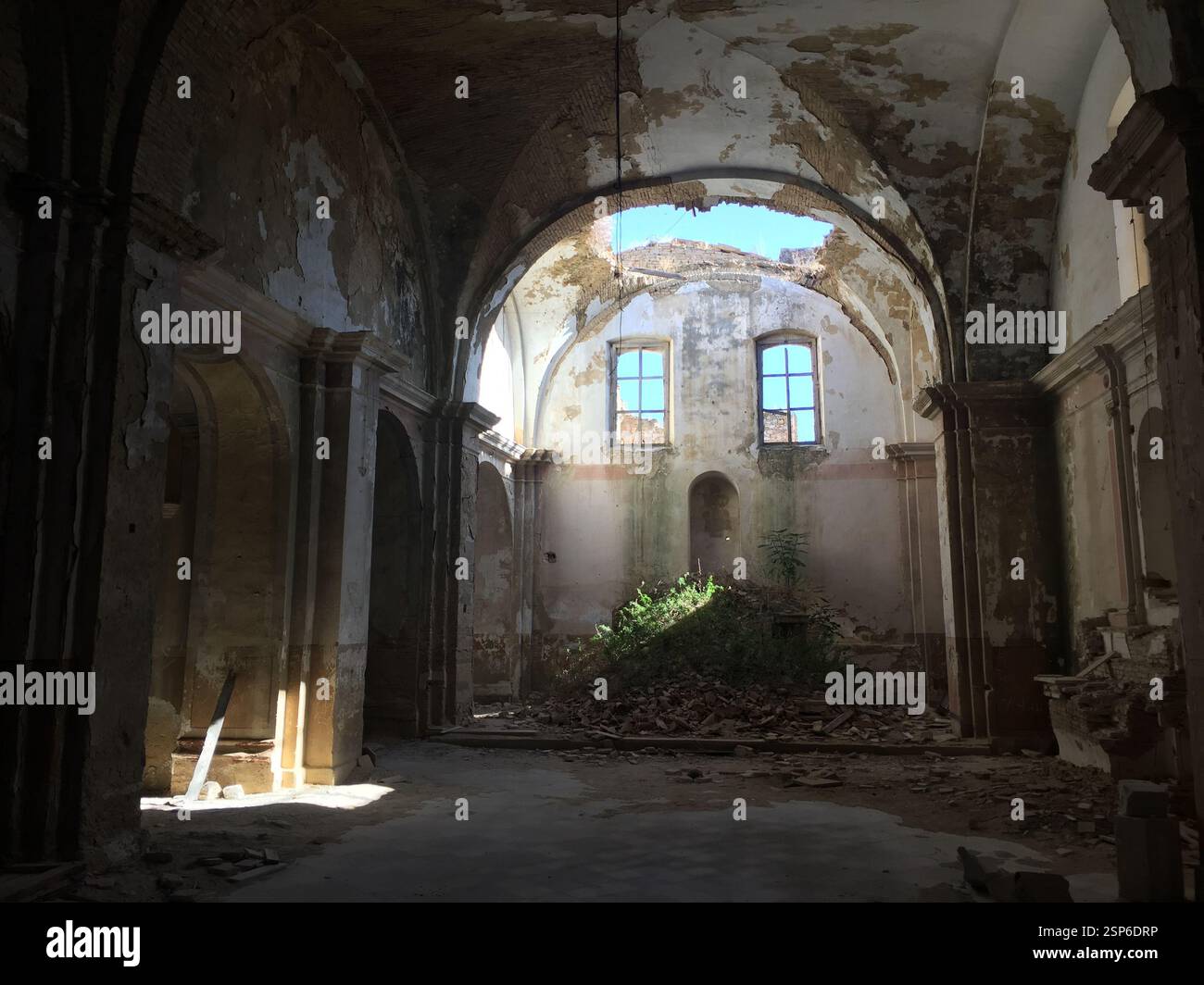 In Craco, Italy, an abandoned church stands in ruins, with crumbling ...