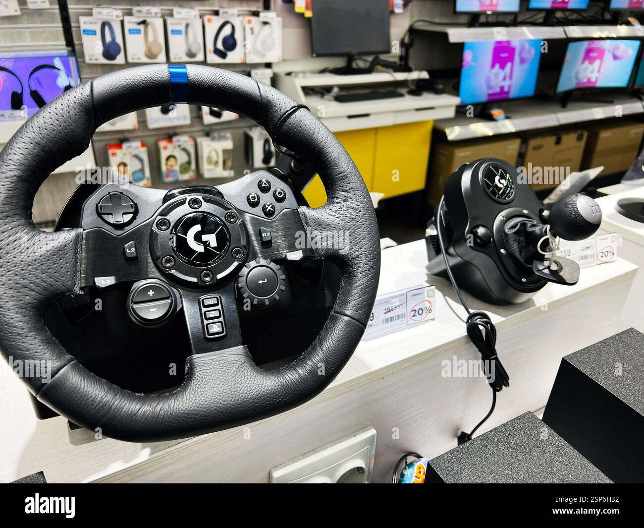 Lviv, Ukraine - February 13, 2025: Gaming steering wheel Logitech and gear simulating ...