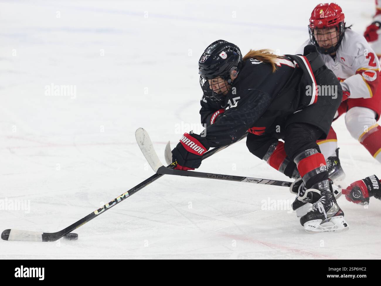 Harbin, China's Heilongjiang Province. 14th Feb, 2025. Ukita Rui (L) of ...