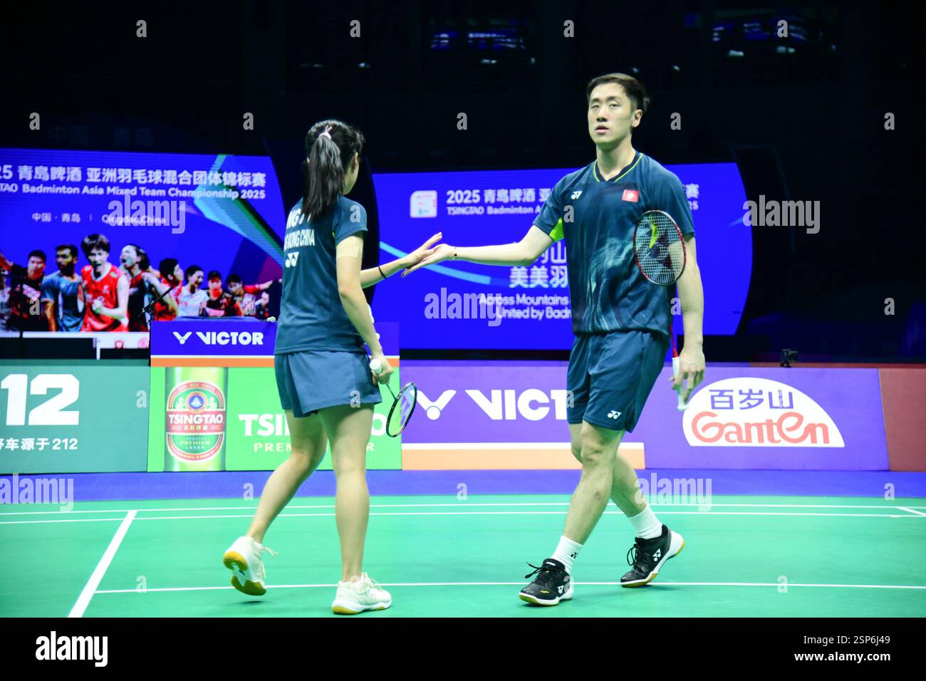 QINGDAO, CHINA - FEBRUARY 14, 2025 - Chinese players Li Hong YI and BAO Li Jing VS TANG Chun Man ...