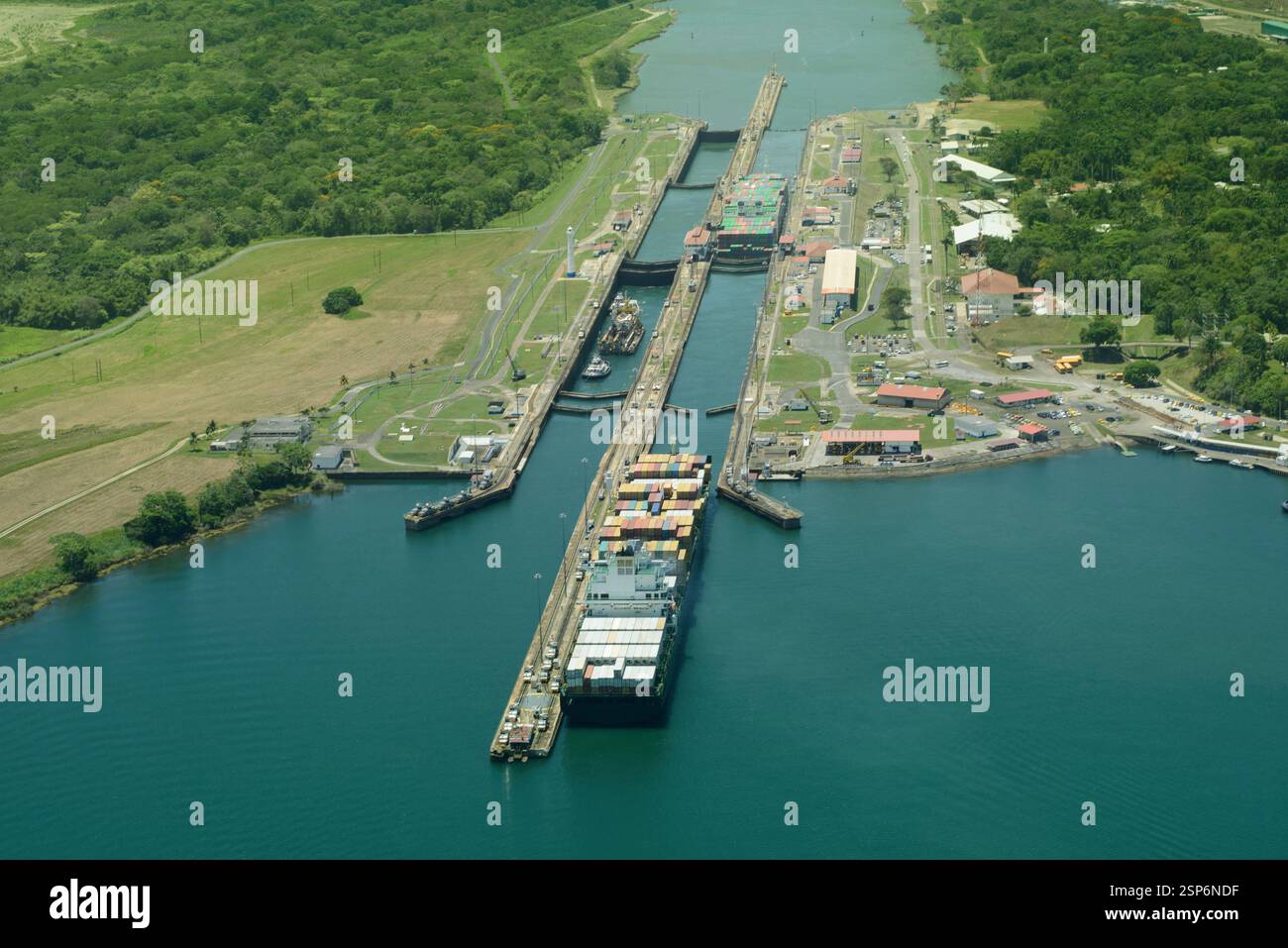 Aerial view of a large container ship navigating through the locks of ...