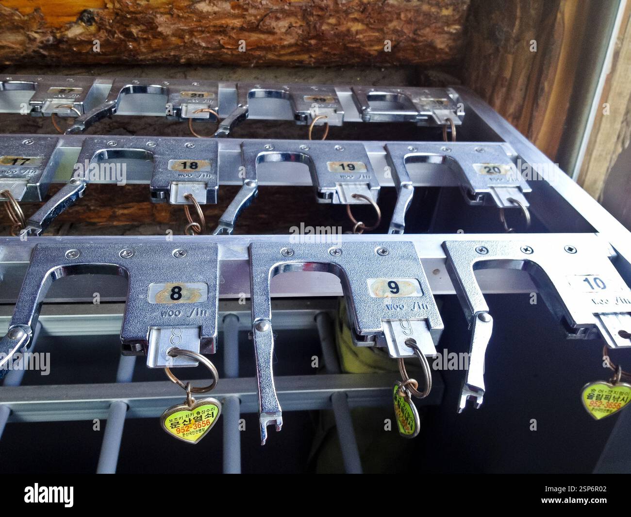 The photo shows a key rack with numbered keys. Some keys have heart ...