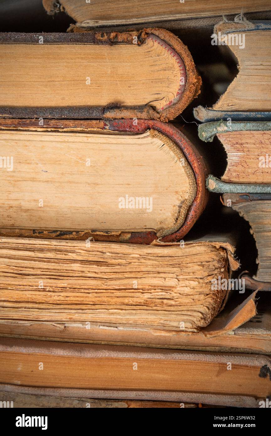 Textured stack of old books close up. Close up of old paper pages of book. Concept of reading ...