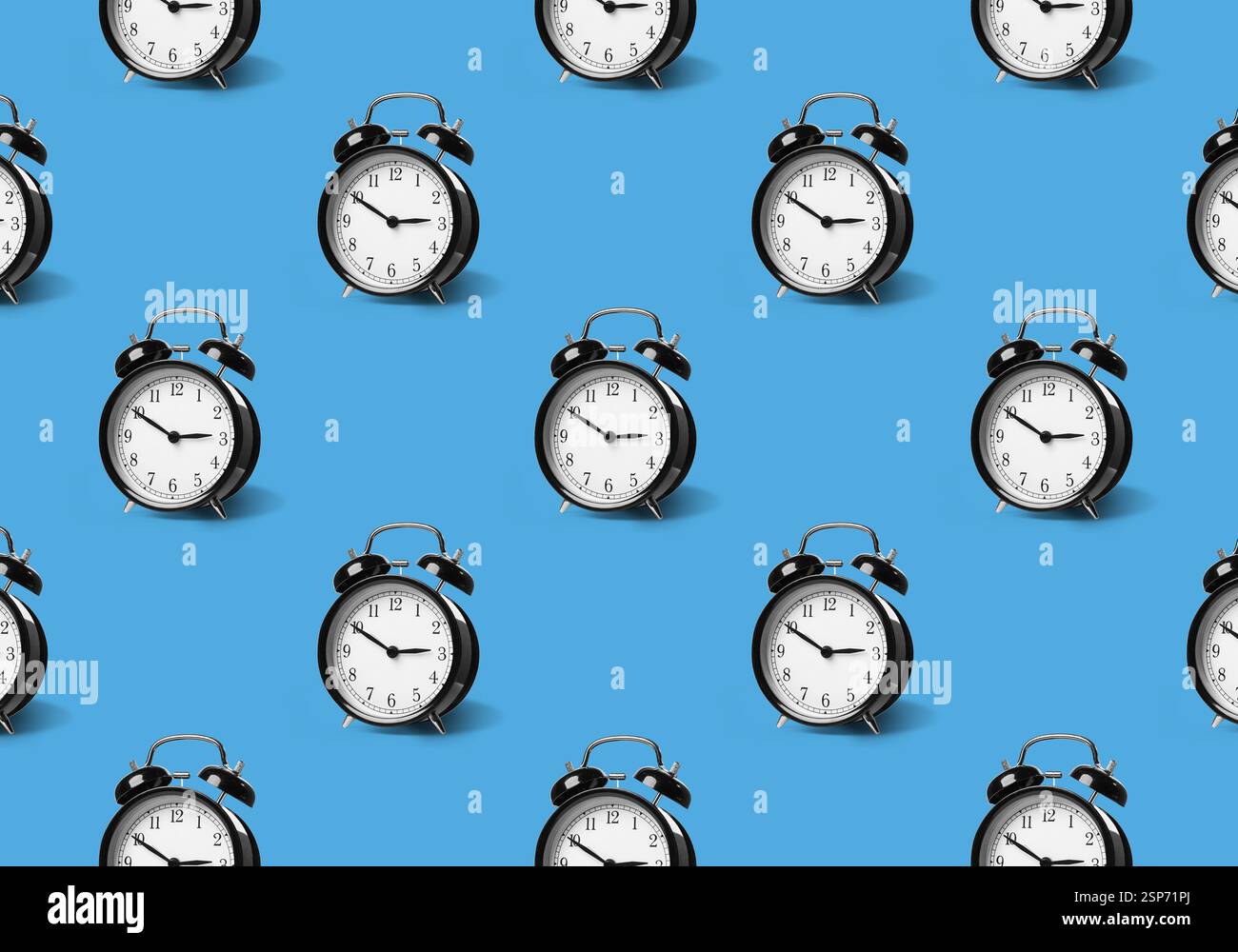Pattern of black alarm clocks on pale blue background Stock Photo - Alamy