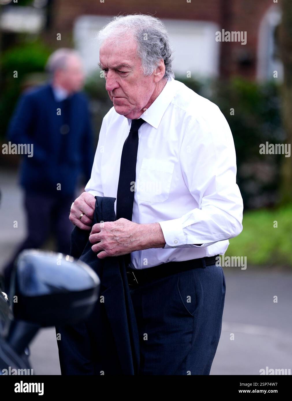 Tommy Booth arriving for the funeral of Tony Book at St. Mary Magdalene ...