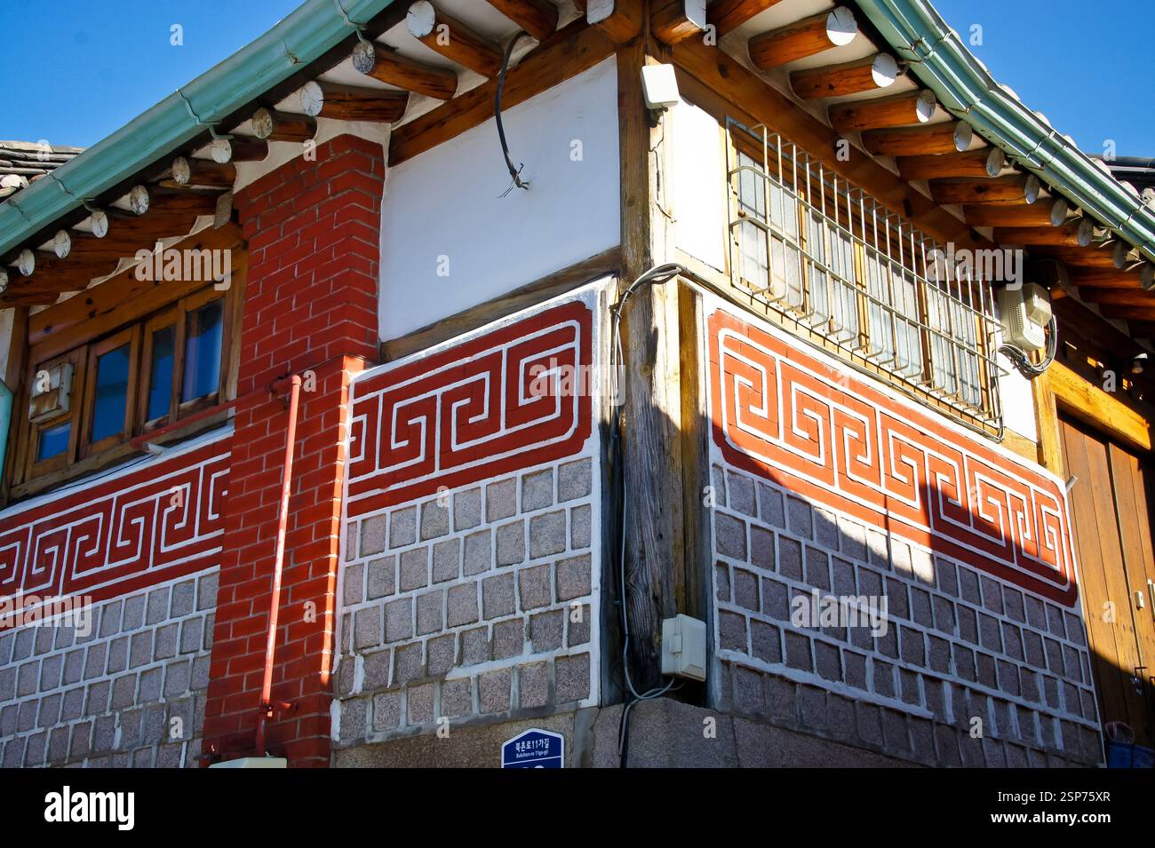 Korean Hanok. Traditional Korean house with red brick walls and white ...