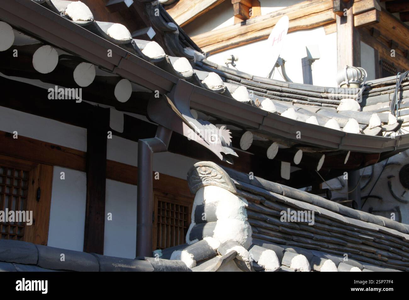 Korean traditional roof tiles. Curved shapes with decorative circles ...