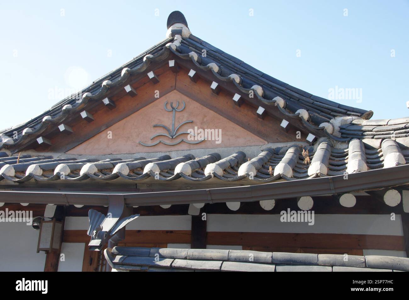 Korean traditional house roof. Decorative ornament on the gable. Yin ...