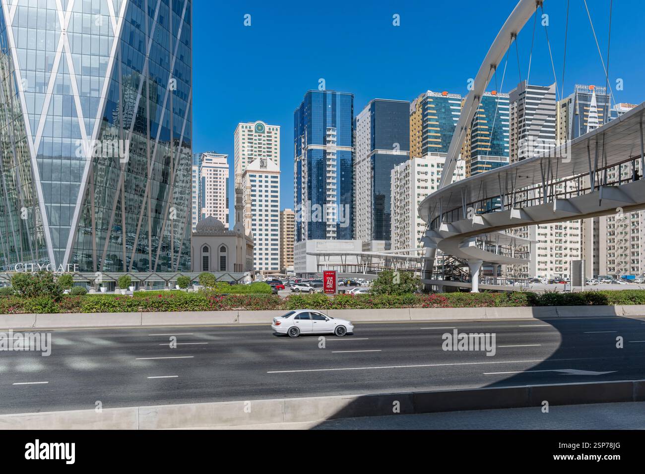 Twisting triangular City Gate Tower on the main road into Sharjah from ...