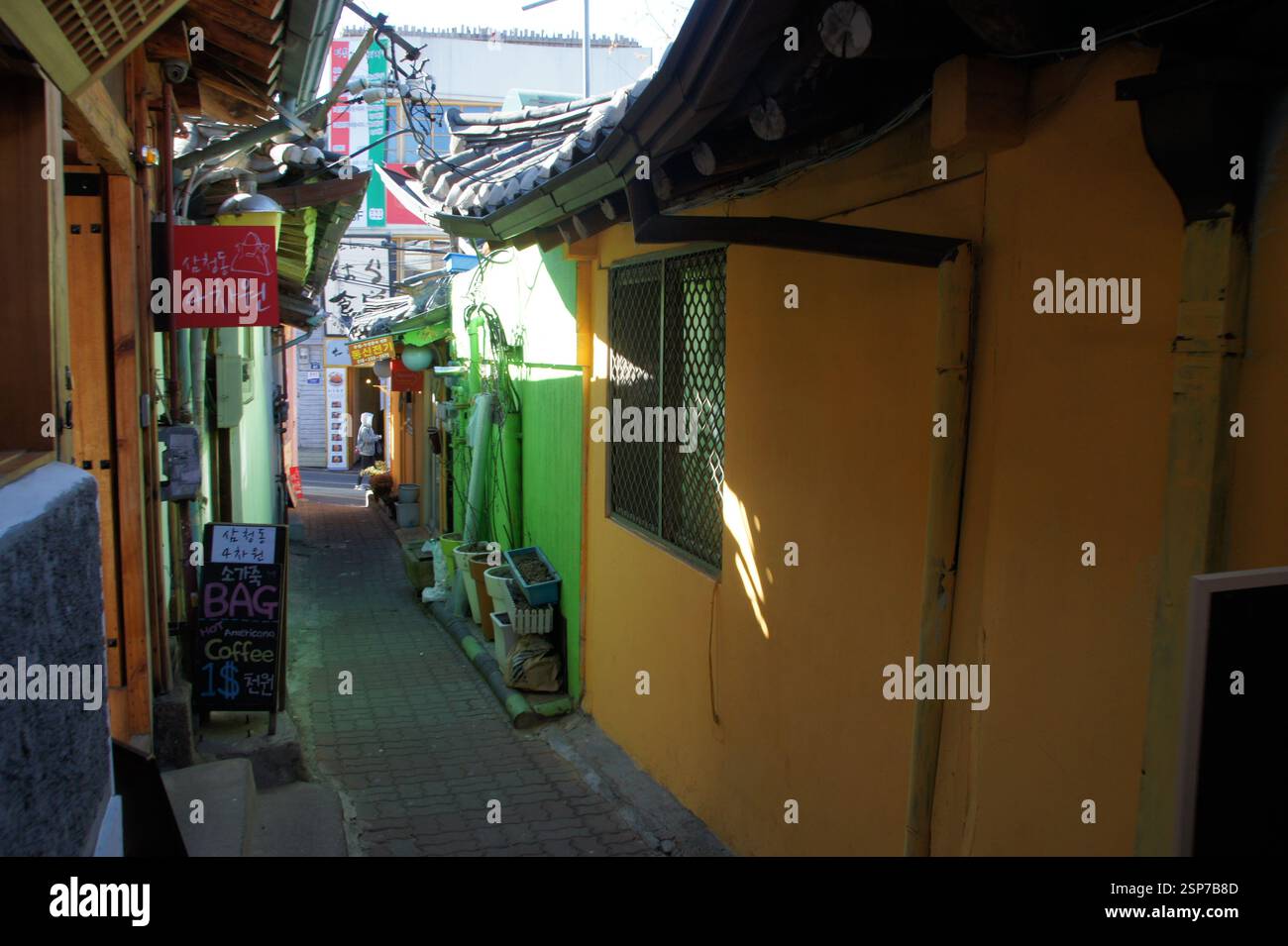 Bukchon Hanok Village alleyway, South Korea. Colorful buildings line a ...