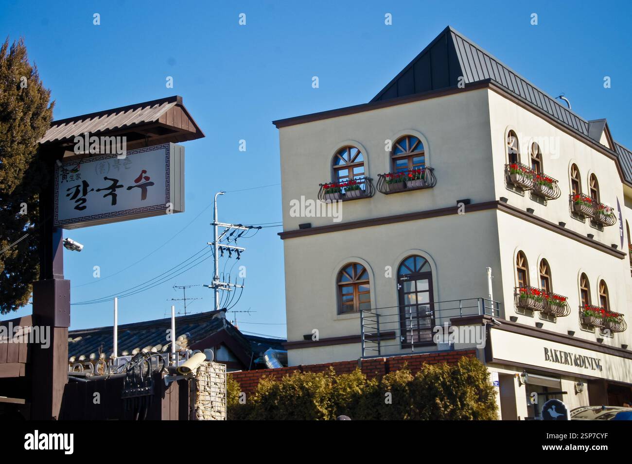 Korean Restaurant in South Korea. Hangeul sign, white building with ...