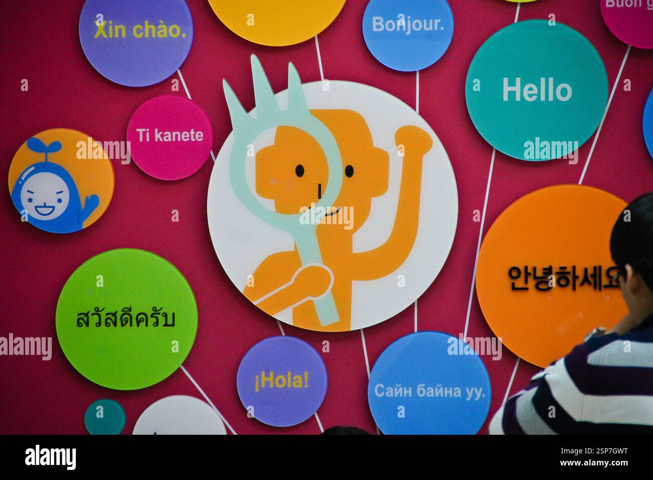 Colorful wall art featuring greetings in various languages. In South ...