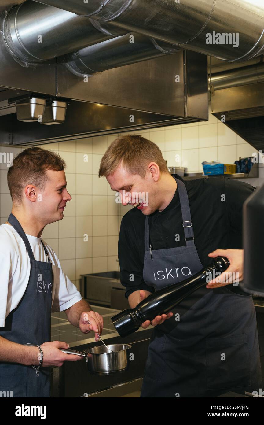 two young chefs in the kitchen Stock Photo - Alamy