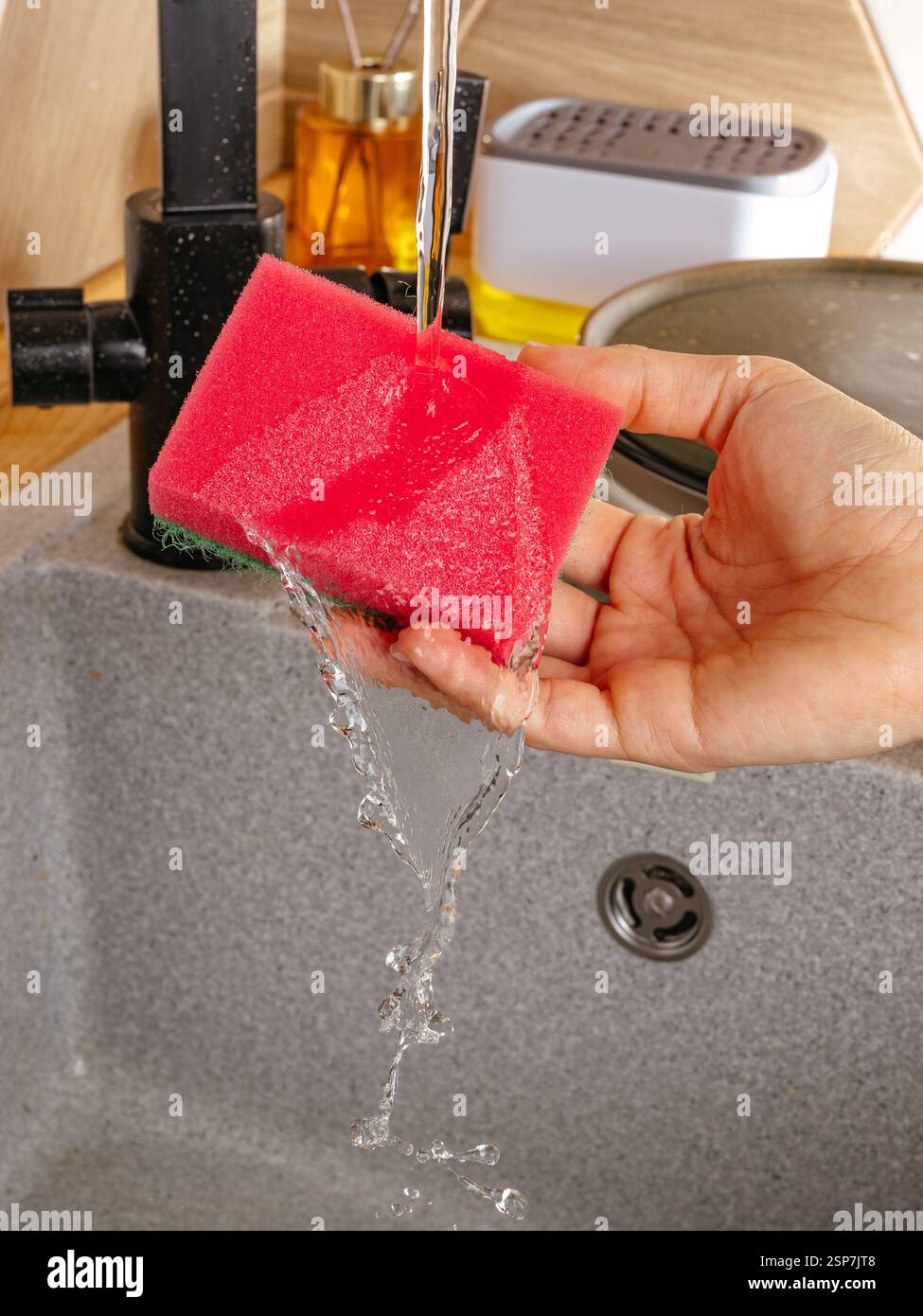 Washing sponge under running hi-res stock photography and images - Alamy