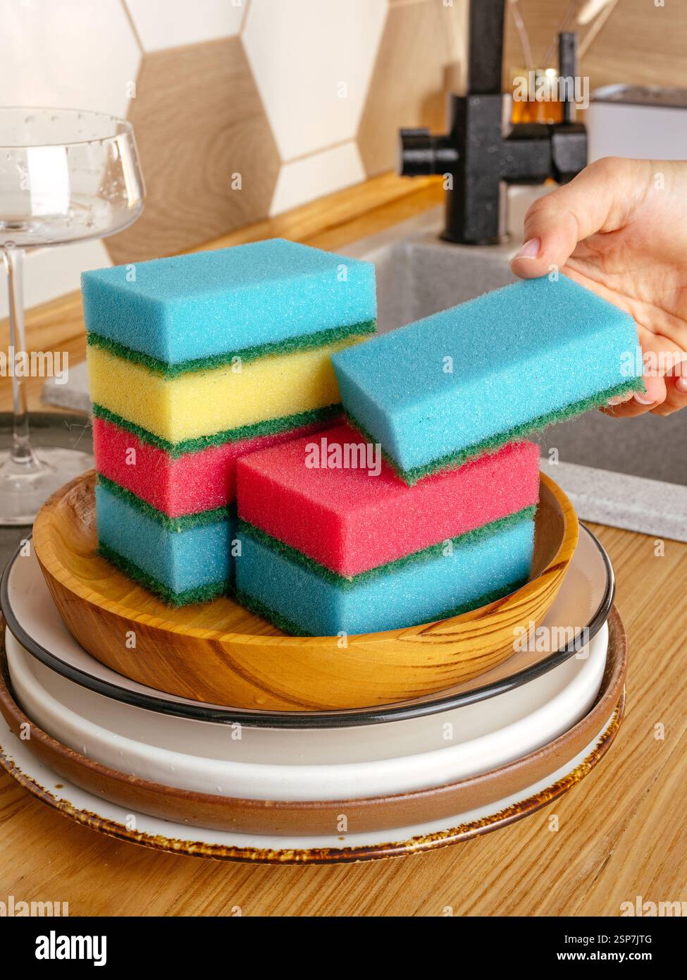 kitchen dishwashing sponges and plates Stock Photo - Alamy