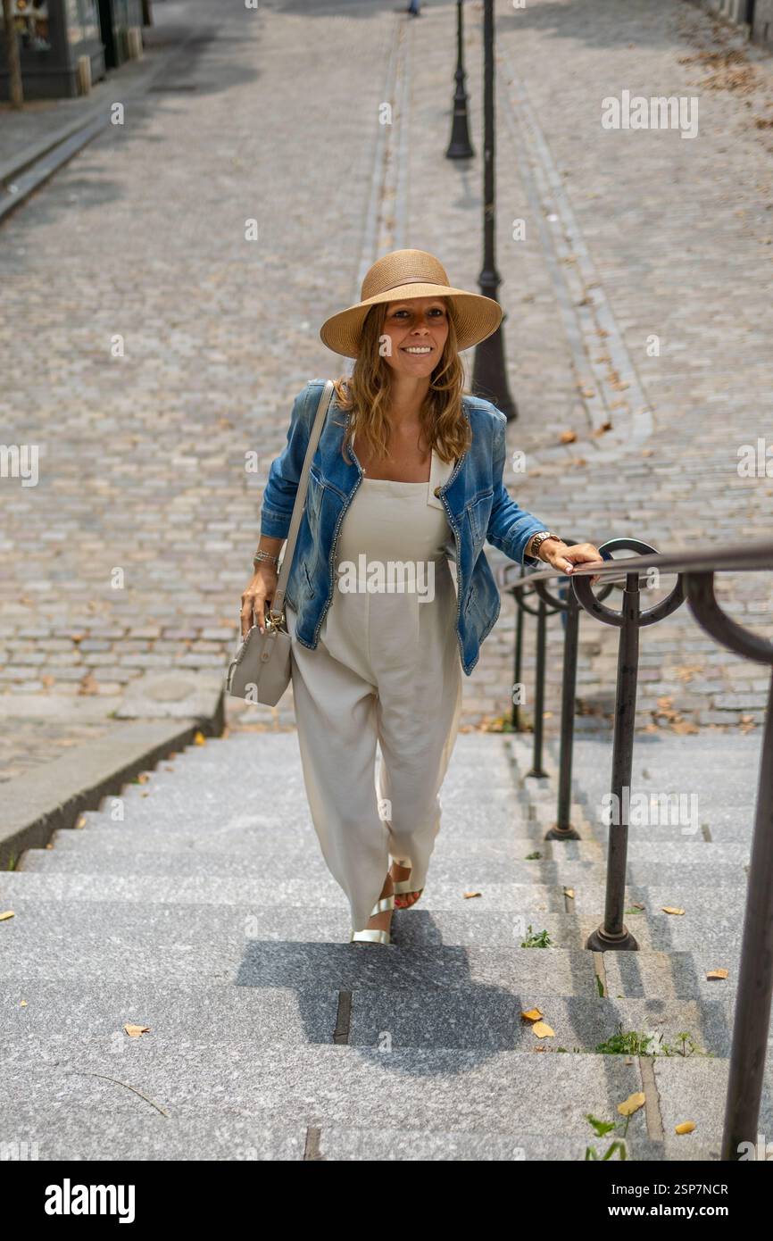 Woman climbing cobblestone steps in Montmartre, Paris Stock Photo - Alamy