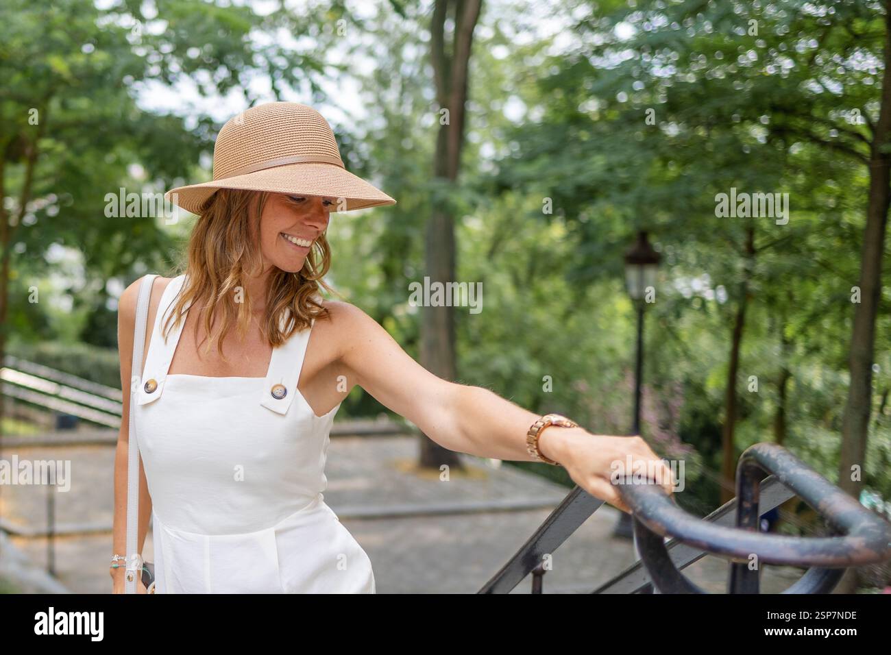Elegant woman enjoying a serene moment in Montmartre Stock Photo - Alamy