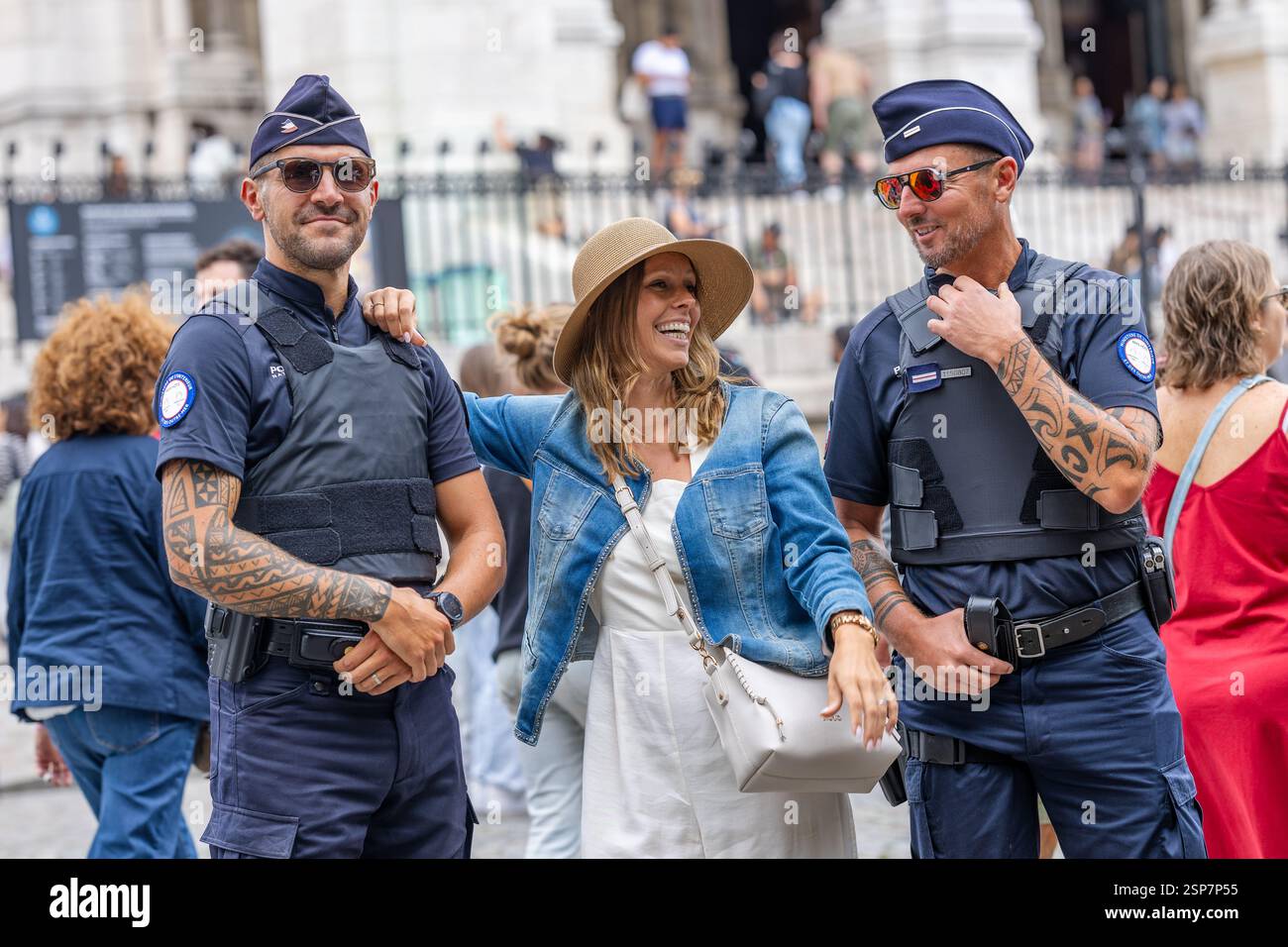 Happy woman posing with two police officers outdoors Stock Photo - Alamy