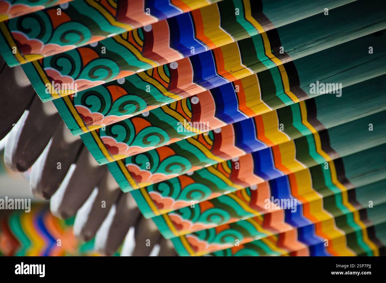 Korean temple ceiling. Brightly painted wooden planks with intricate ...