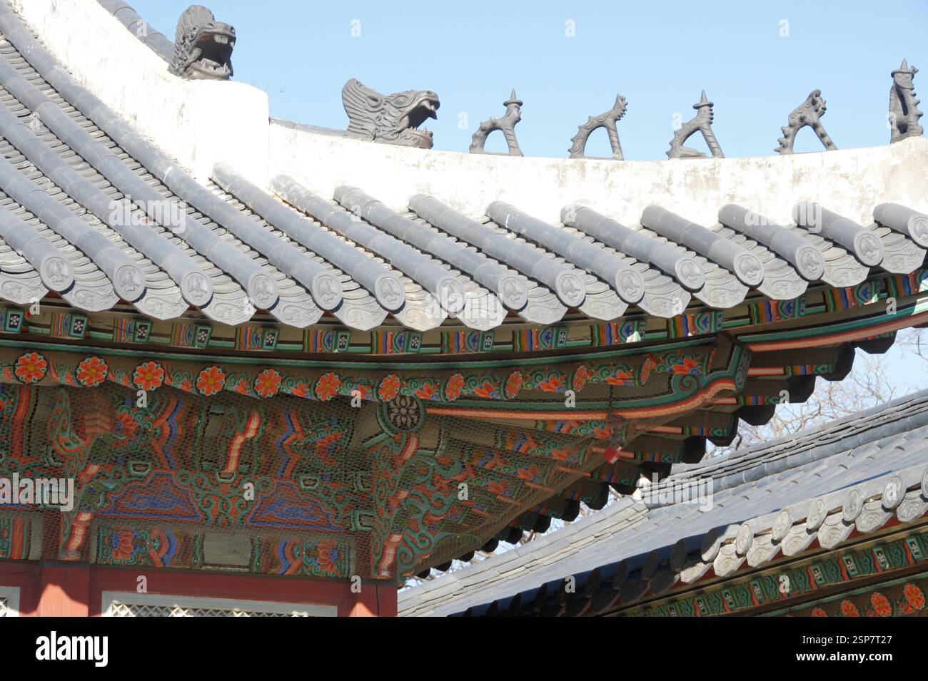 Roof detail. Ornate tiles and painted decorations. Symbol of Korean ...