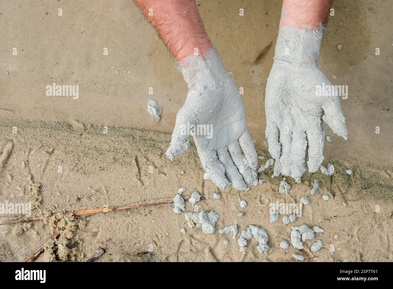 Human hands with clay. Mud baths with blue clay. Unique blue clay from ...