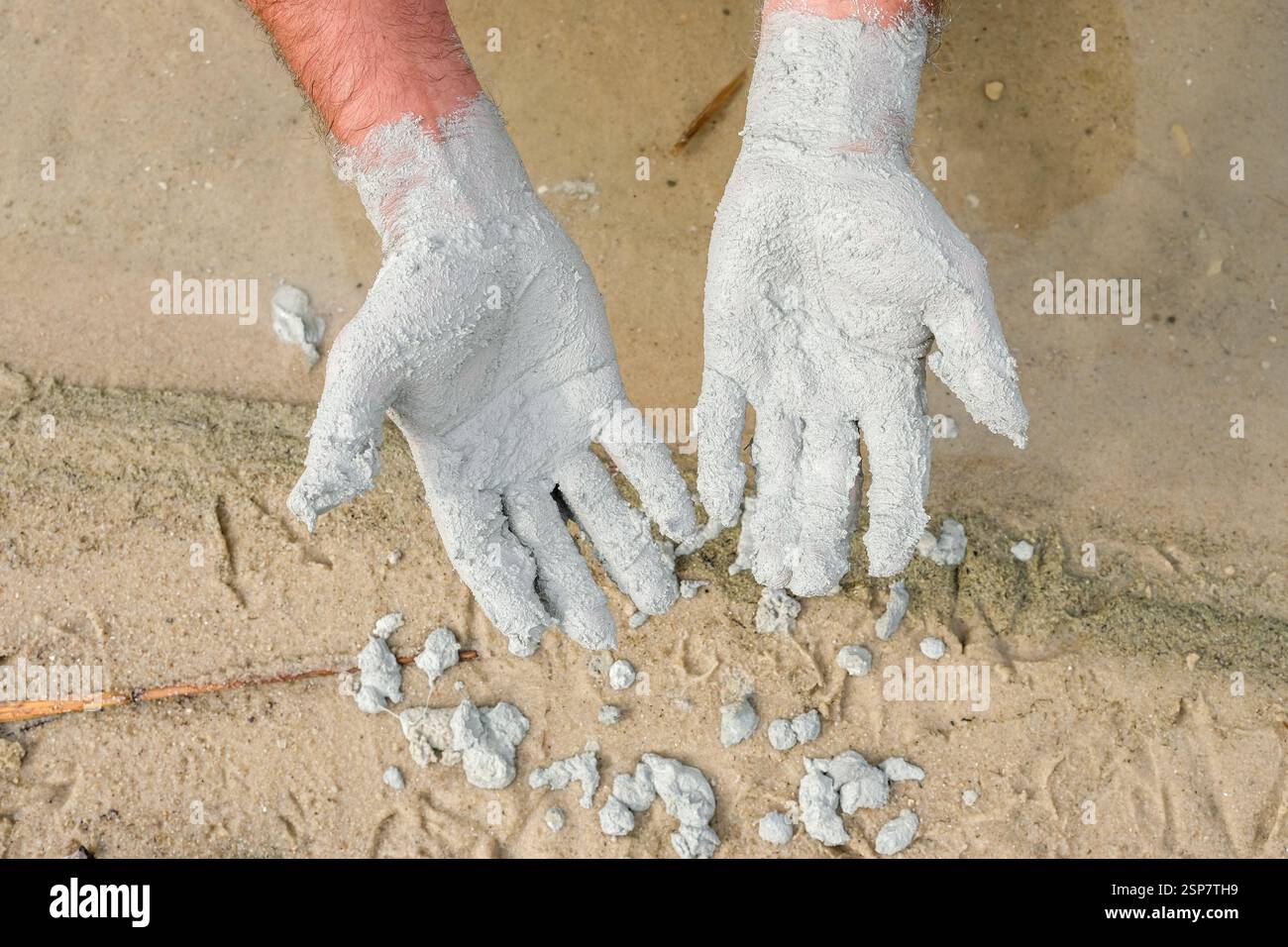 Human hands with clay. Mud baths with blue clay. Unique blue clay from ...