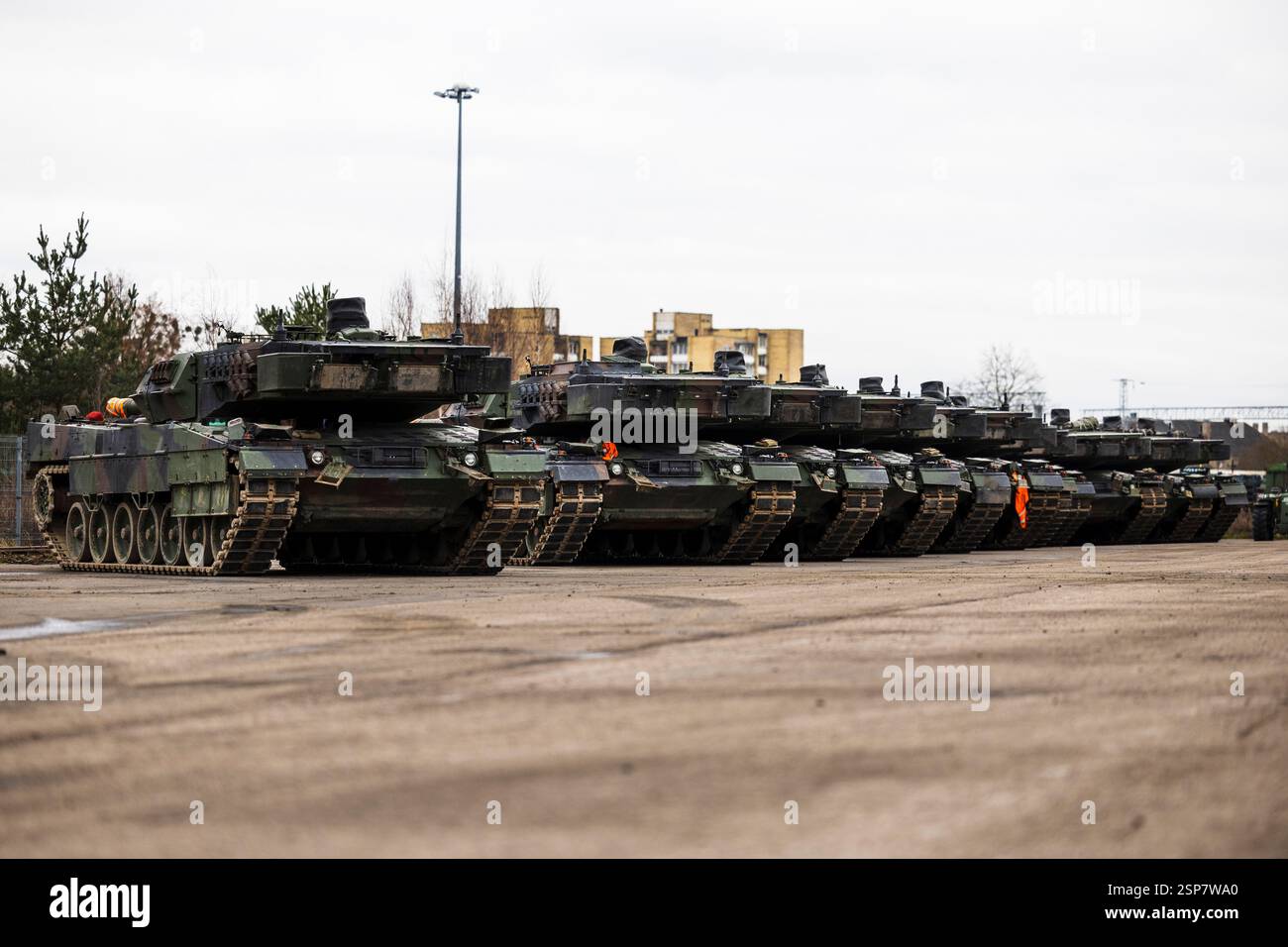 A row of German Leopard 2A7 main battle tanks parked in a military ...