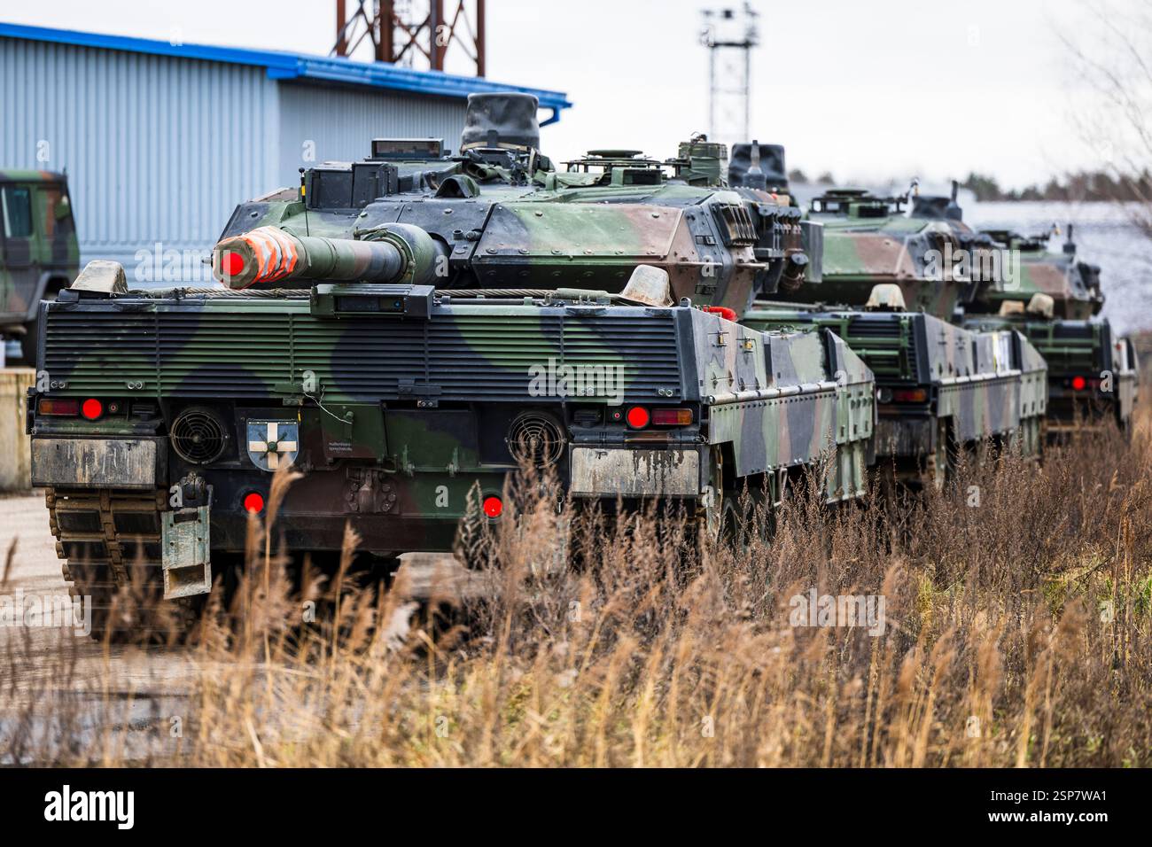 A row of German Leopard 2A7 main battle tanks parked in a military ...